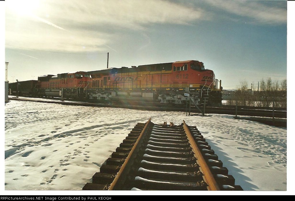 BNSF 6112 AND 9381 roll south to Colorado Springs, CO., as rear DPU's on a loaded coal train.